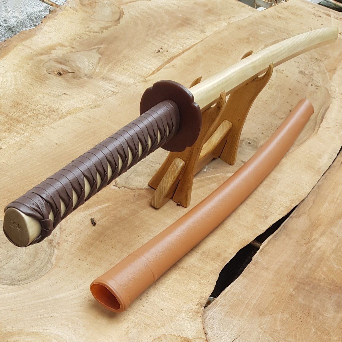 Wooden bokken daito with brown plastic tsuba, plastic saya and tsukama ...